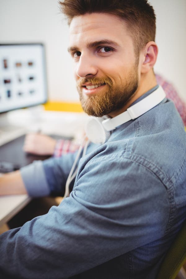 Happy Editor Using Tablet As Team Works Behind Her Stock Photo - Image ...