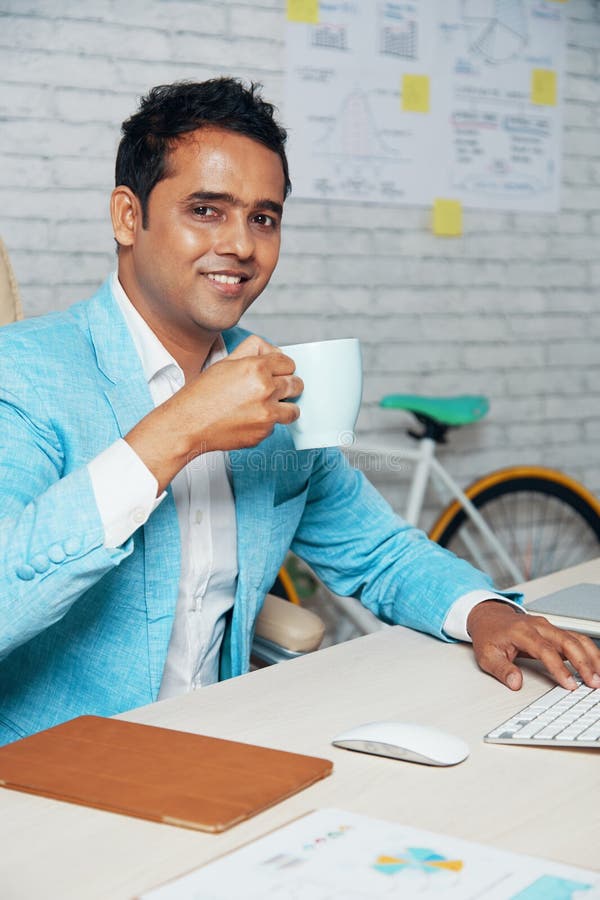 Businessman Drinking Coffee at Workplace Stock Image - Image of ...