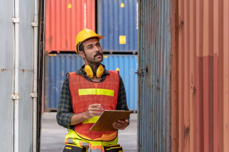 Portrait of Confident Inspector Standing in Front of Containers in Port ...