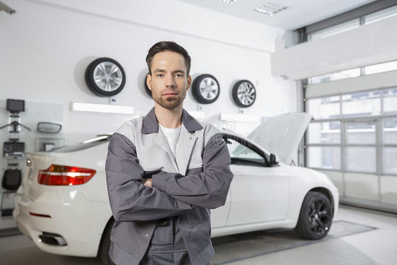 Mechanic Standing in Front of Car Stock Photo - Image of business ...