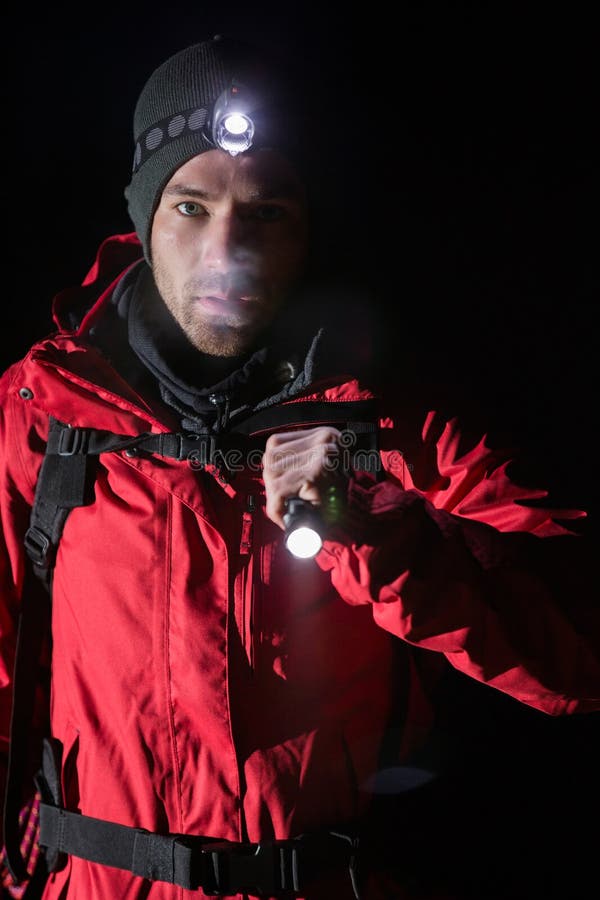 Portrait of Confident Male Hiker with Flashlight at Night Stock Image ...