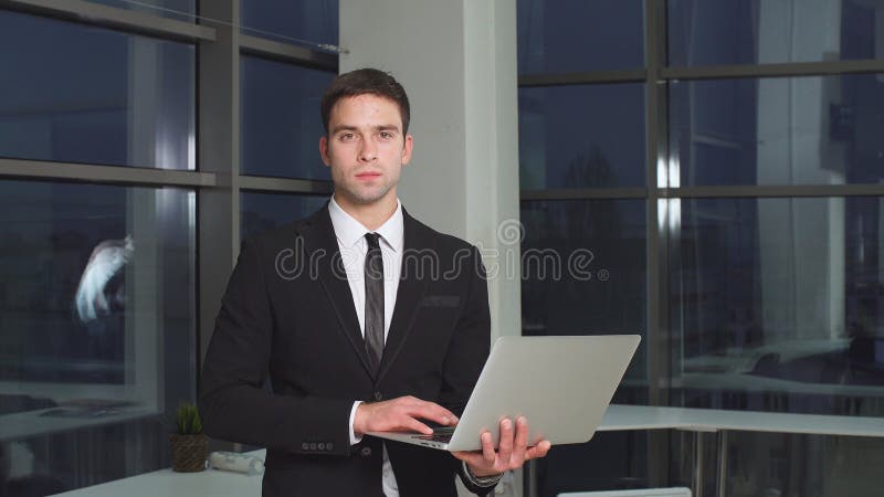 Portrait of Confident Modern Businessman with Laptop in Hands Stock ...