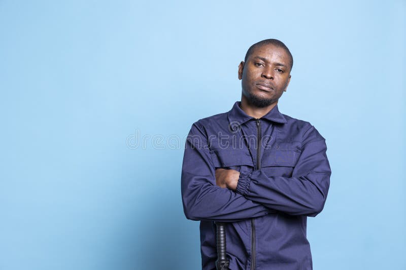 Portrait of Confident Security Agent Posing with Arms Crossed in Studio ...