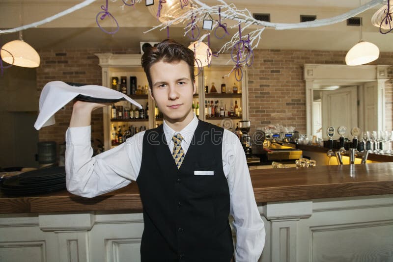 Portrait of Confident Waiter Carrying Serving Tray in Restaurant Stock ...