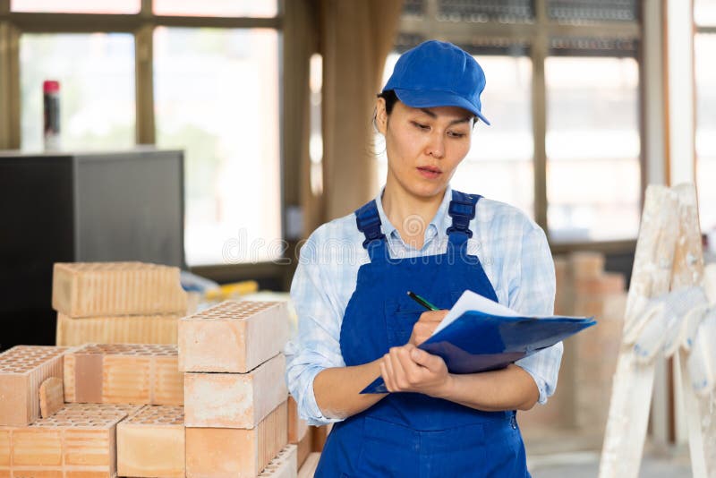 Woman Making Notes on Indoor Construction Site Stock Photo - Image of ...