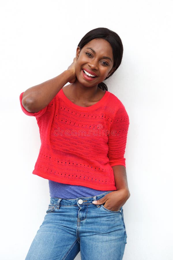 Confident Young Black Woman Smiling with Hand Behind Head Against White ... Confident Young Black Woman Smiling with Hand Behind Head Against White ...