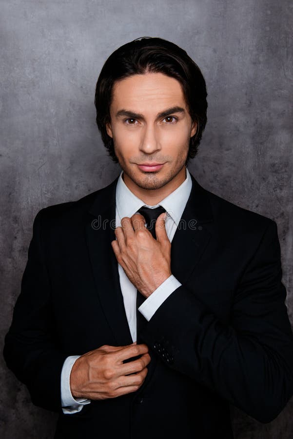 Portrait of Confident Young Man Correcting His Black Tie Stock Image ...