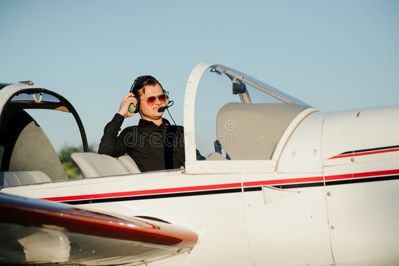 Portrait of Confident Young Man Pilot in Small Plane Stock Photo ...