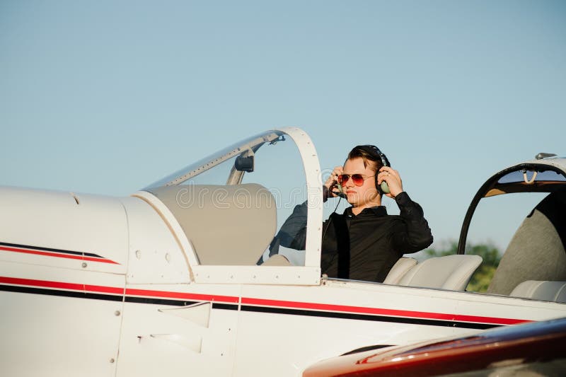 Portrait of Confident Young Man Pilot in Small Plane Stock Image ...