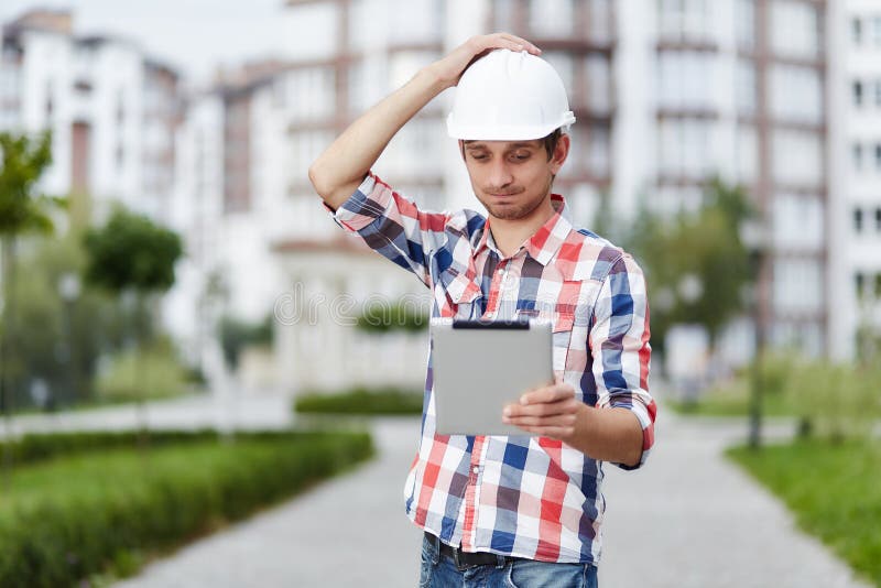 Young Architect in Front of Apartment Building Stock Image - Image of ...