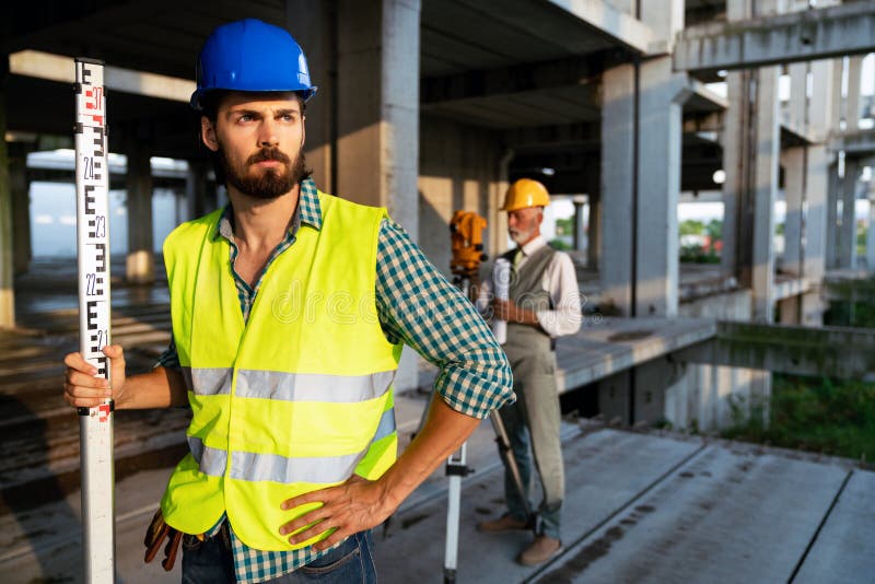 Portrait of Construction Architects, Engineers Working on Building Site ...