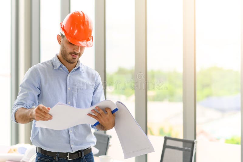 Portrait of Construction Engineer Manager Workers in Orange Hardhat and ...