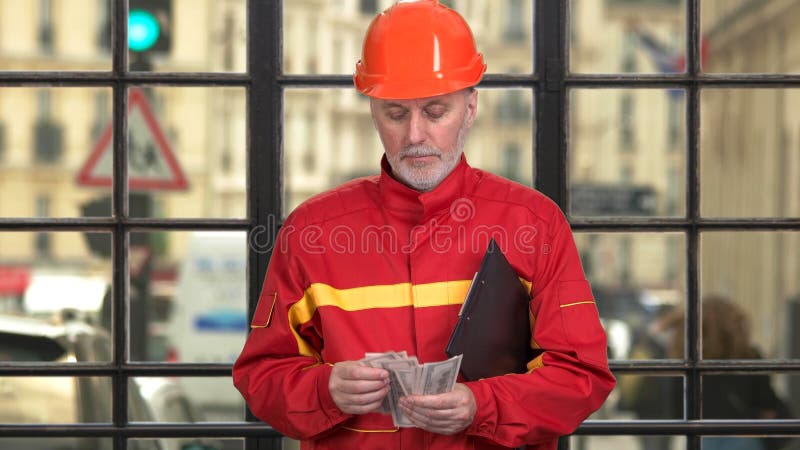 Portrait of Construction Worker is Counting Money. Stock Video - Video ...