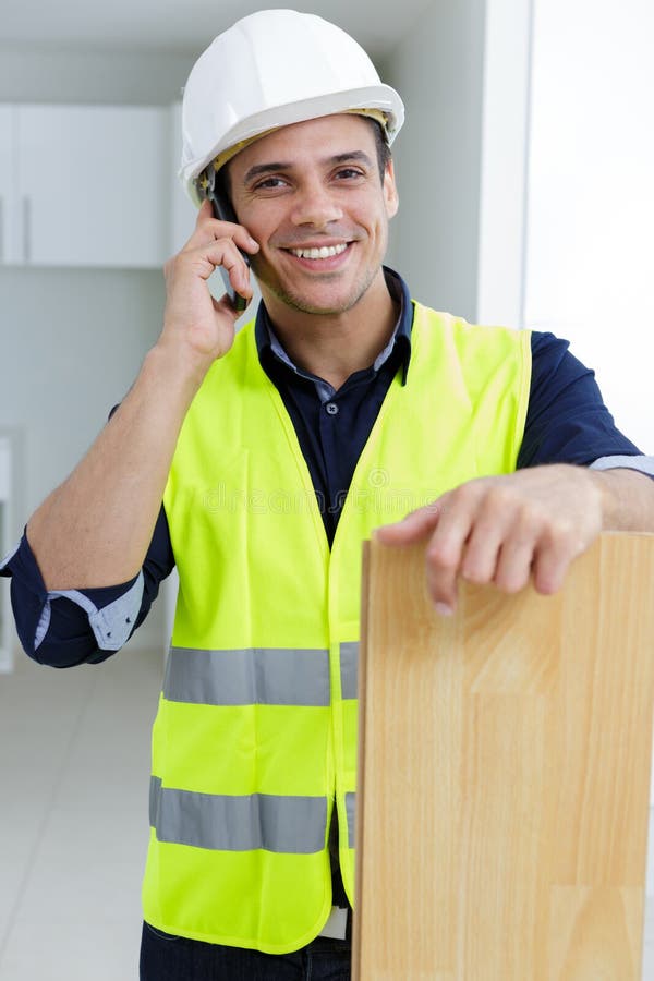 Portrait Construction Worker Discussing Floor Plans Inside Stock Photo ...