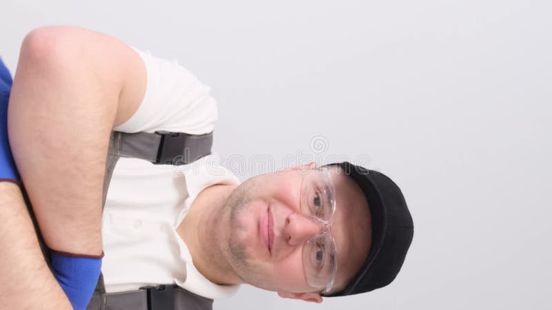 Portrait of a Construction Worker in the Studio on a White Background ...
