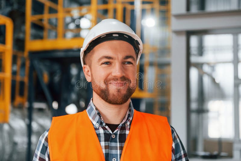 Portrait of Construction Worker in Uniform is in the Factory Stock ...
