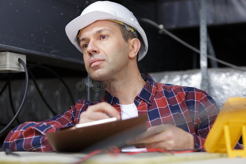 Portrait Construction Worker Writing on Clipboard Stock Image - Image ...