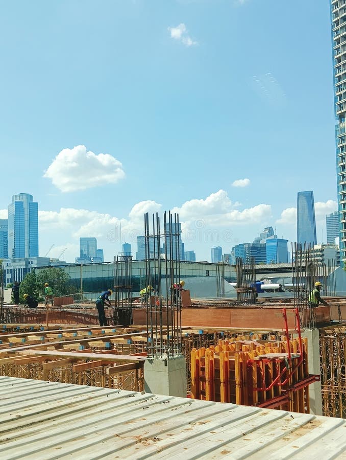 Portrait of Construction Workers Working on Building Construction Stock ...