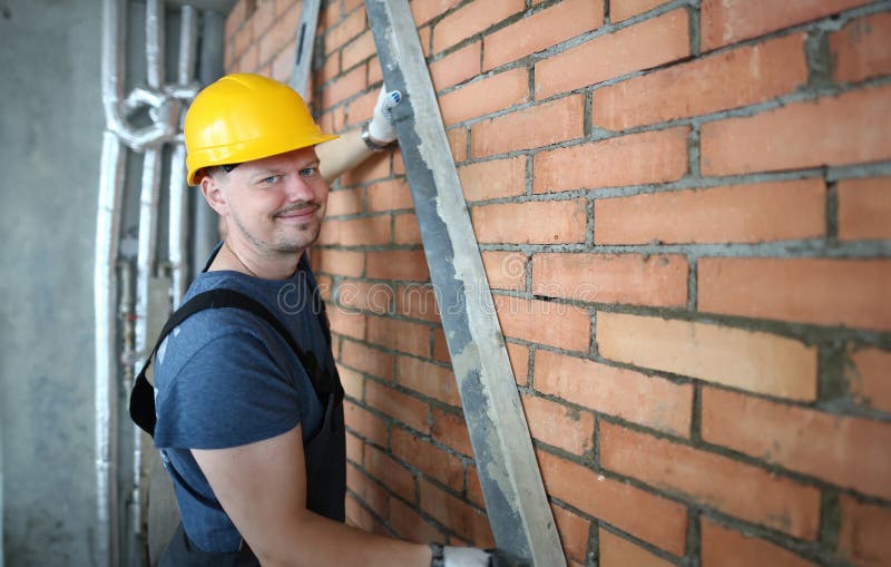 Portrait of Constructor Making Brick Wall Smooth in Order To Plastering ...