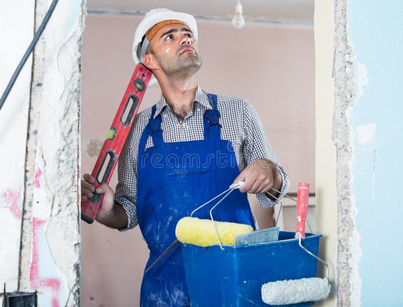 Portrait of Constructor Man Which is Standing with Spirit Level and ...