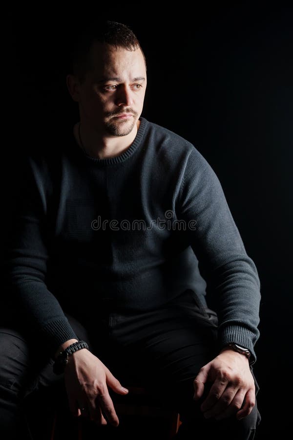 Portrait of a Contemplative Man in Low Light Stock Photo - Image of ...