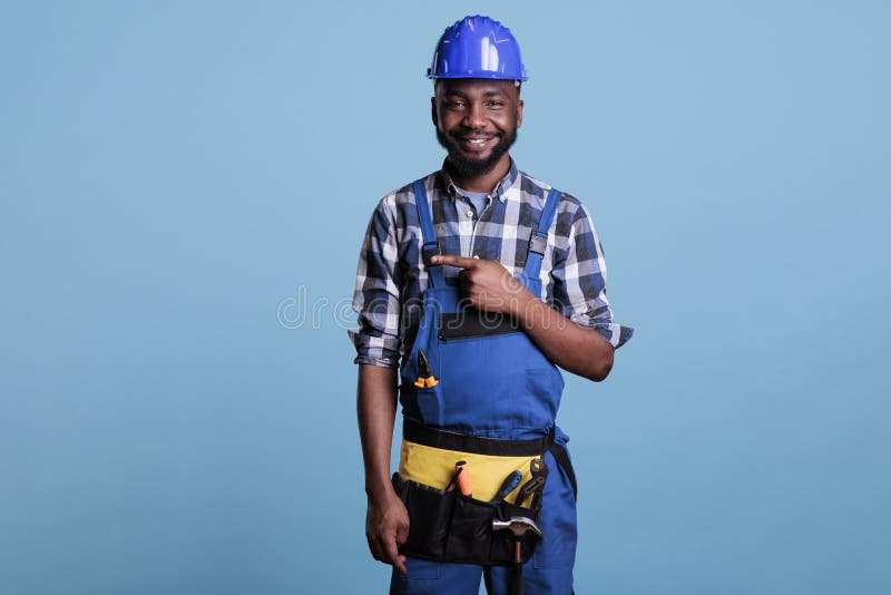 Happy Contractor Pointing His Finger To the Side Stock Photo - Image of ...
