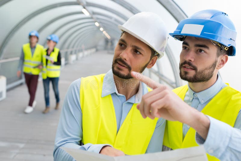 Portrait Contractors Pointing at Something Stock Photo - Image of ...