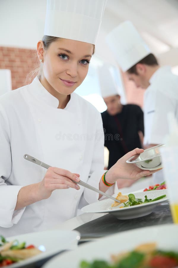 Portrait of a Cooking Apprentice Preparing Dish Stock Photo - Image of ...