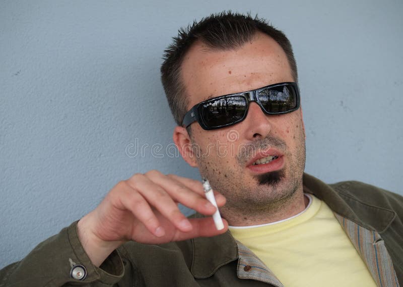 Portrait of Cool Young Man stock photo. Image of cigarette - 711634