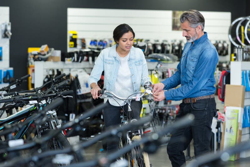 Bicycle Salesman Advising Customer Stock Image - Image of workshop ...