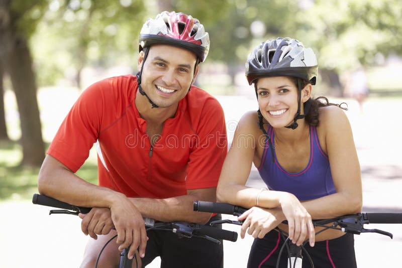 Portrait of Couple on Cycle Ride through Park Stock Image - Image of ...