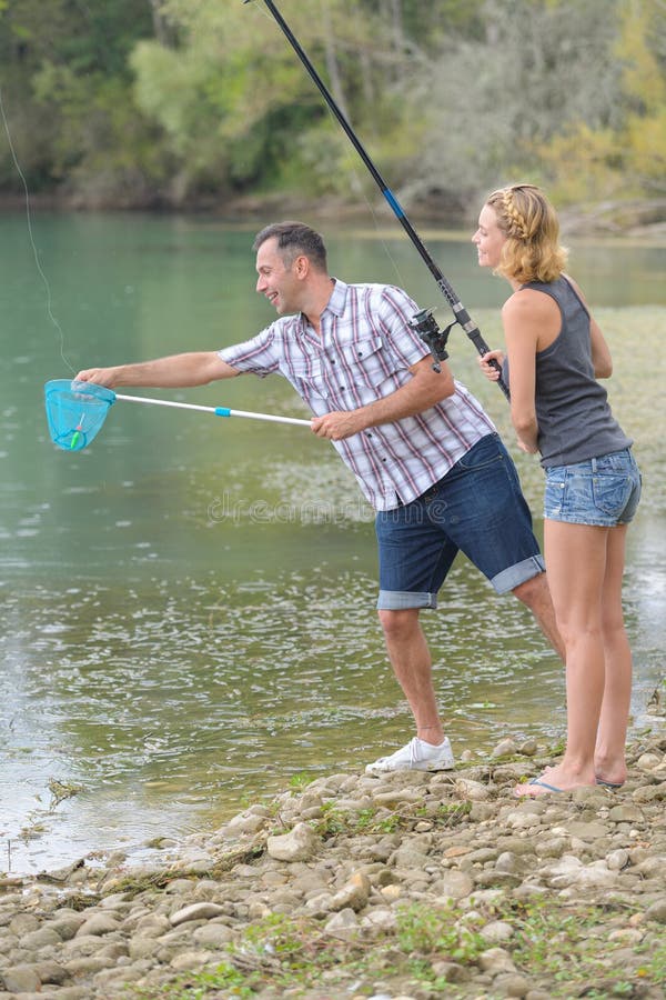 Portrait couple fishing stock photo. Image of couple - 266082258