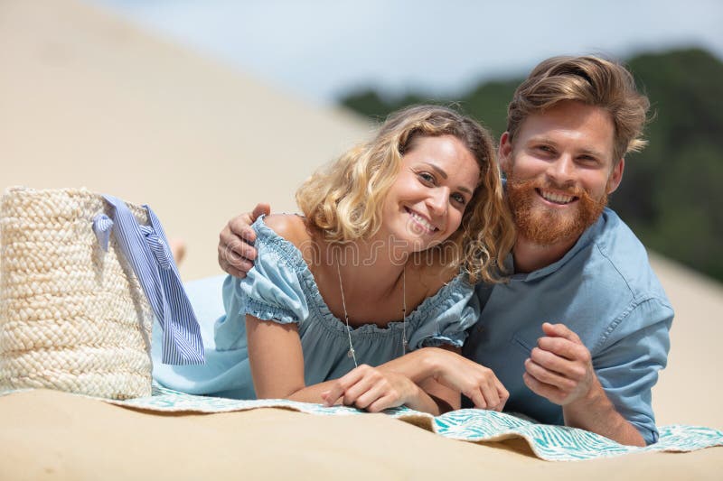 Portrait Couple Laid on Sand Stock Image - Image of closeup, holiday ...