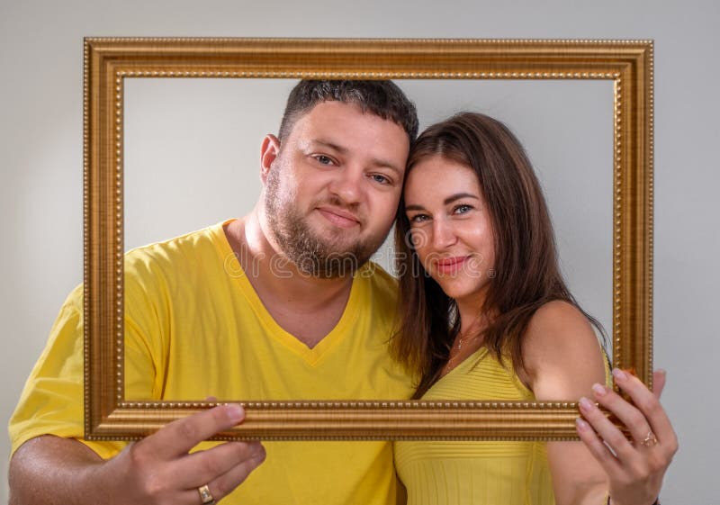Portrait of a Couple in Yellow Clothes in a Frame Stock Image - Image ...