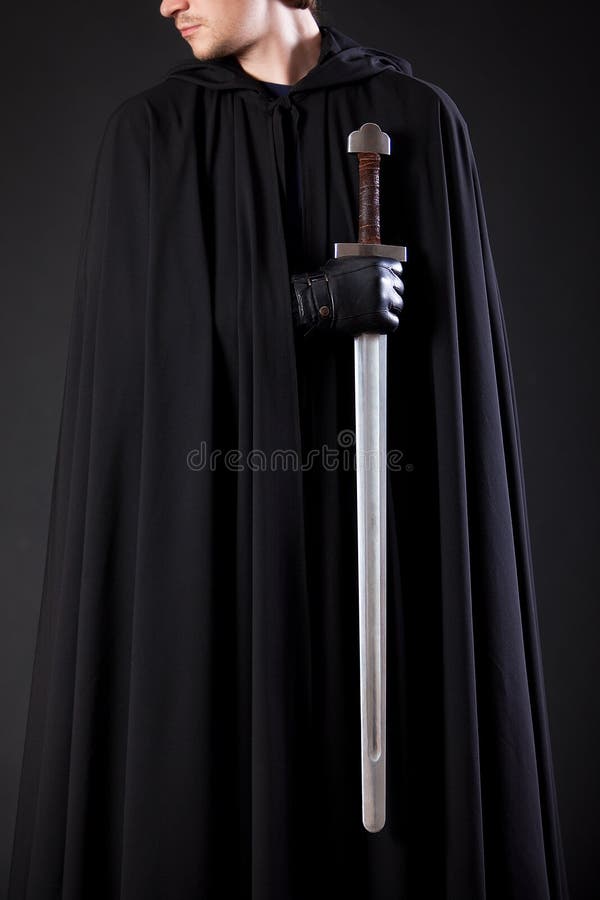 Portrait of a Courageous Warrior Wanderer in a Black Cloak and Sword in ...