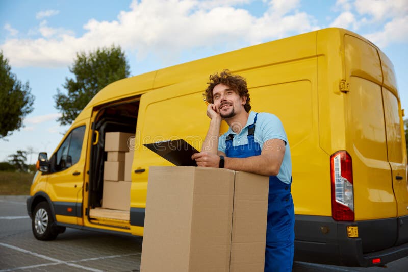 Portrait of Courier Enjoying Rest Leaning at Parcel Box Stack Stock ...