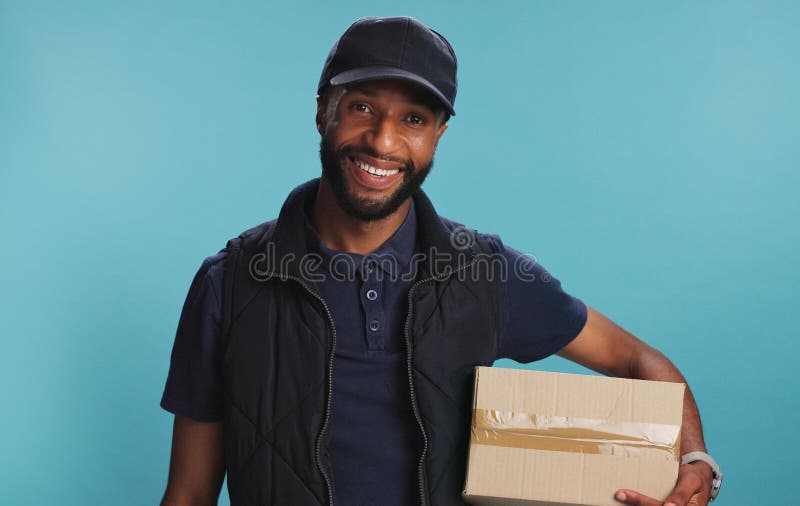 Portrait, Courier and Happy Black Man with Box in Studio for Ecommerce ...