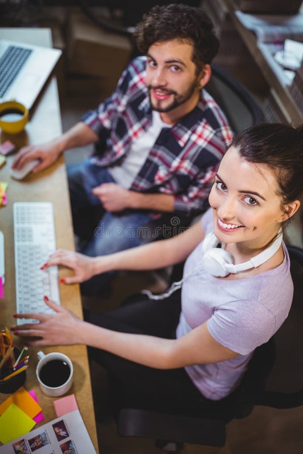 Portrait of Coworkers Working at Computer Desk Stock Photo - Image of ...