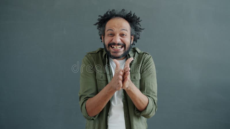 Portrait of Crazy Office Worker in Red Cape and Mask Stretching Arm and ...