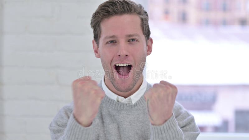 Portrait of Creative Young Man Celebrating Success Stock Photo - Image ...