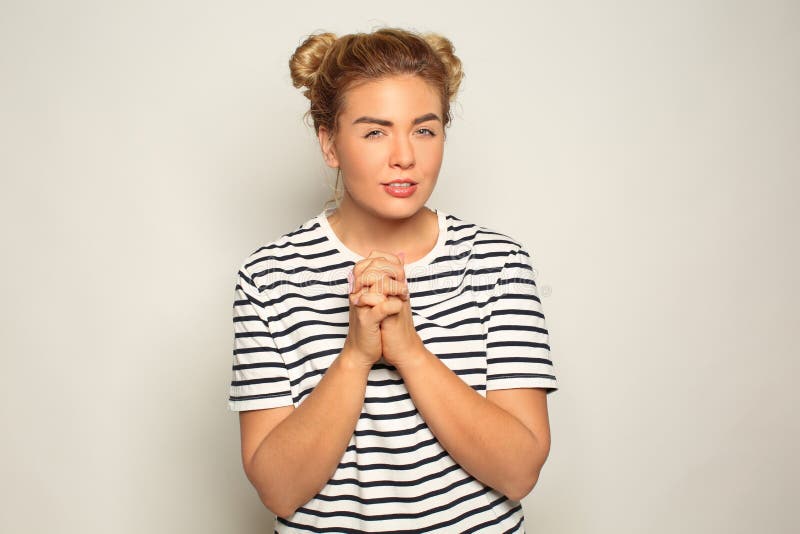 Portrait of Cunning Young Woman on Light Background Stock Photo - Image ...