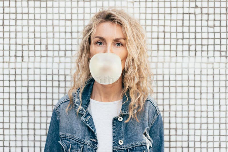 124 Beautiful Blonde Woman Blowing Bubble Gum Fashion Portrait Stock