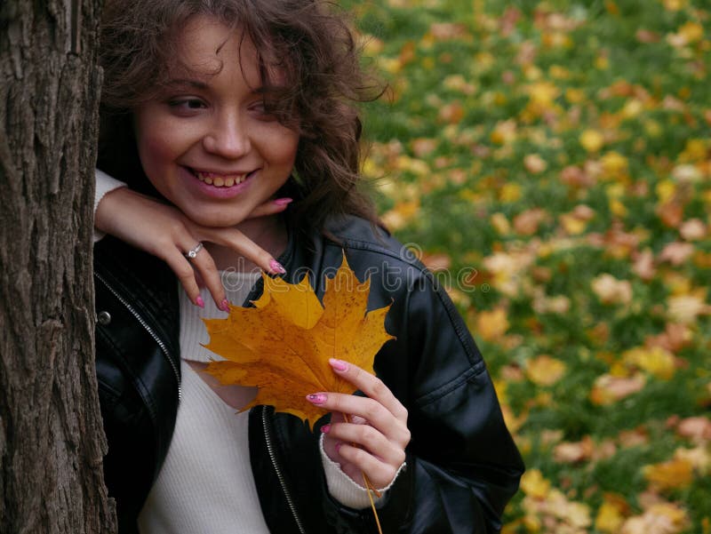 Portrait of a Curly Brunette Caucasian Female Posing with a Yellow ...