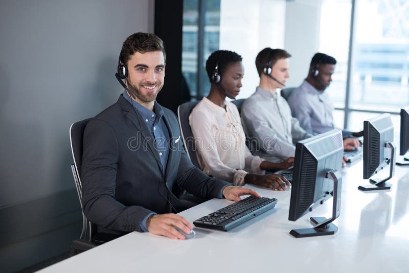 Customer Service Executives Working at Office Stock Photo - Image of ...