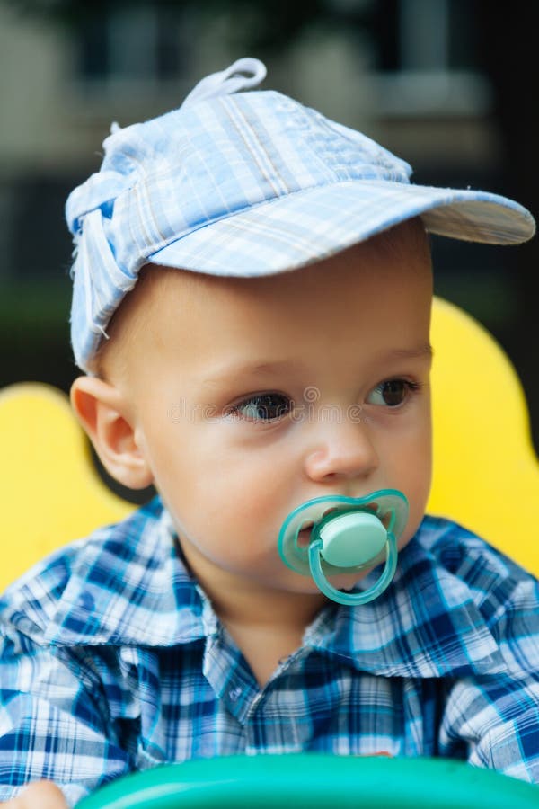 Portrait of a Cute Baby with Pacifier Stock Photo - Image of grass ...