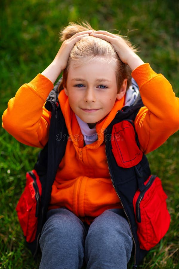 Portrait of Cute Boy on Green Lawn Stock Photo - Image of looking ...