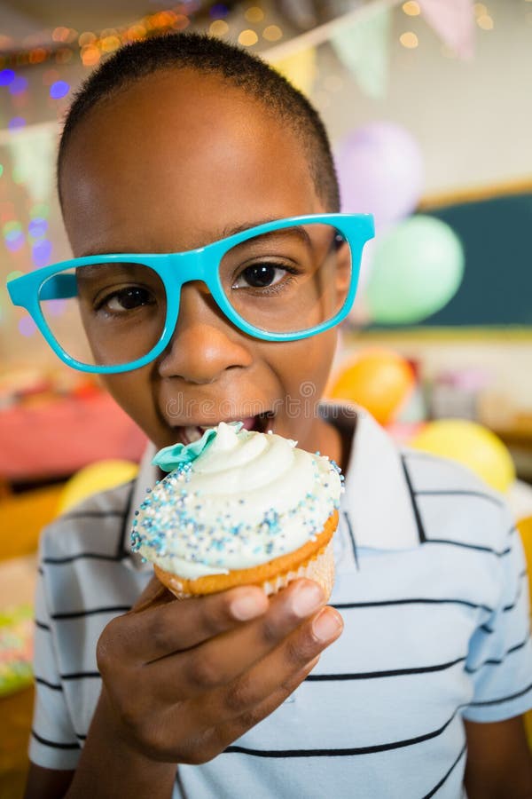 Portrait of Cute Boy Having Cupcake during Birthday Party Stock Image ...