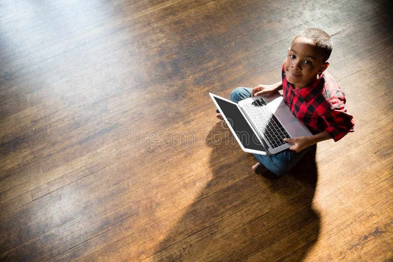 Portrait of Cute Boy Using Laptop Stock Photo - Image of casual, home ...