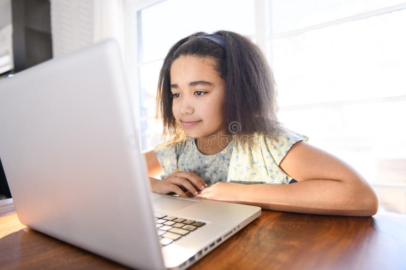 Portrait of Cute Child Doing Homework on Kitchen Table with Laptop ...