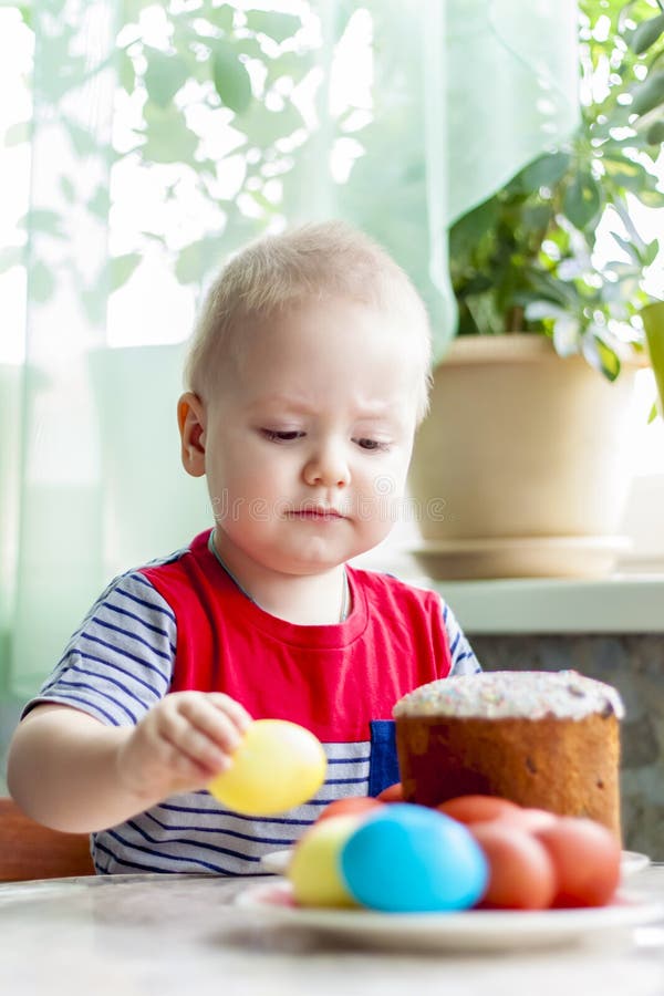 Portrait of a Cute Child with Easter Eggs. Easter Lunch Stock Photo ...